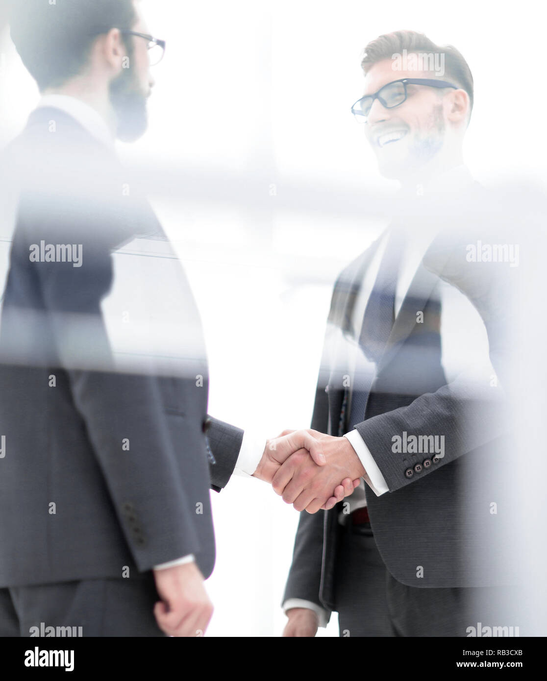 handshake is serious business partners Stock Photo - Alamy