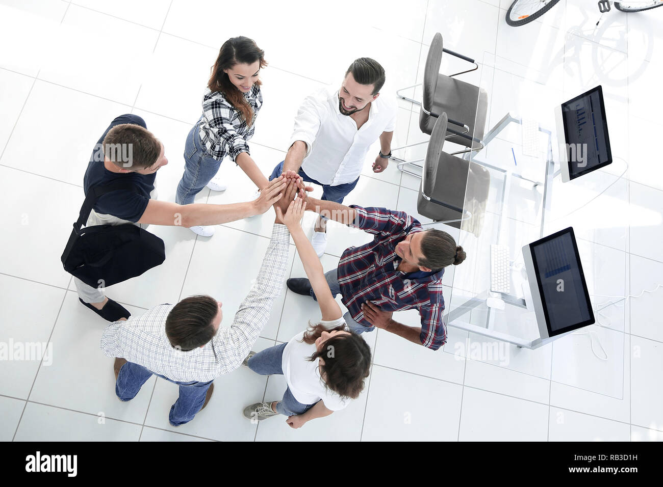team of young designers shows their success Stock Photo - Alamy