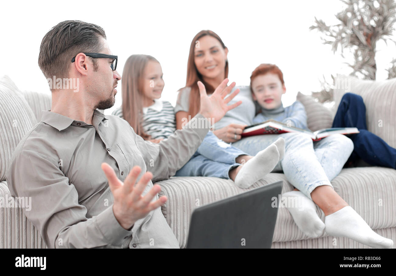 happy family discussing something sitting in their living room Stock ...