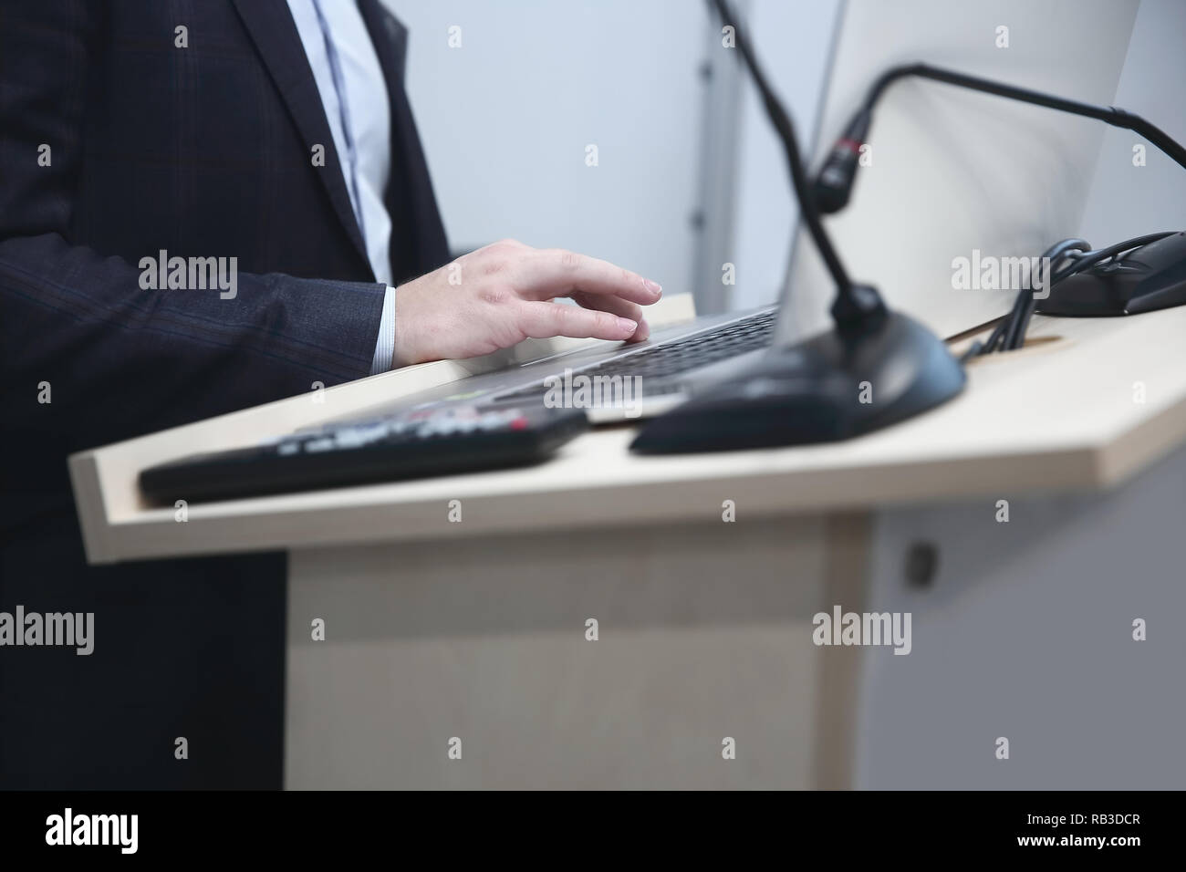 Speaker giving talk on podium at Business Conference Stock Photo - Alamy
