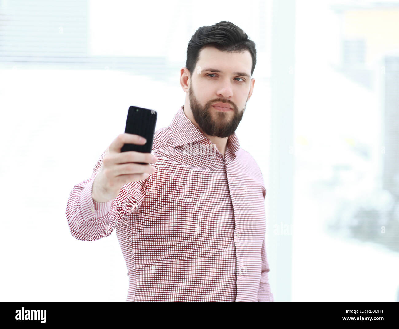 handsome man taking selfie in the office Stock Photo - Alamy
