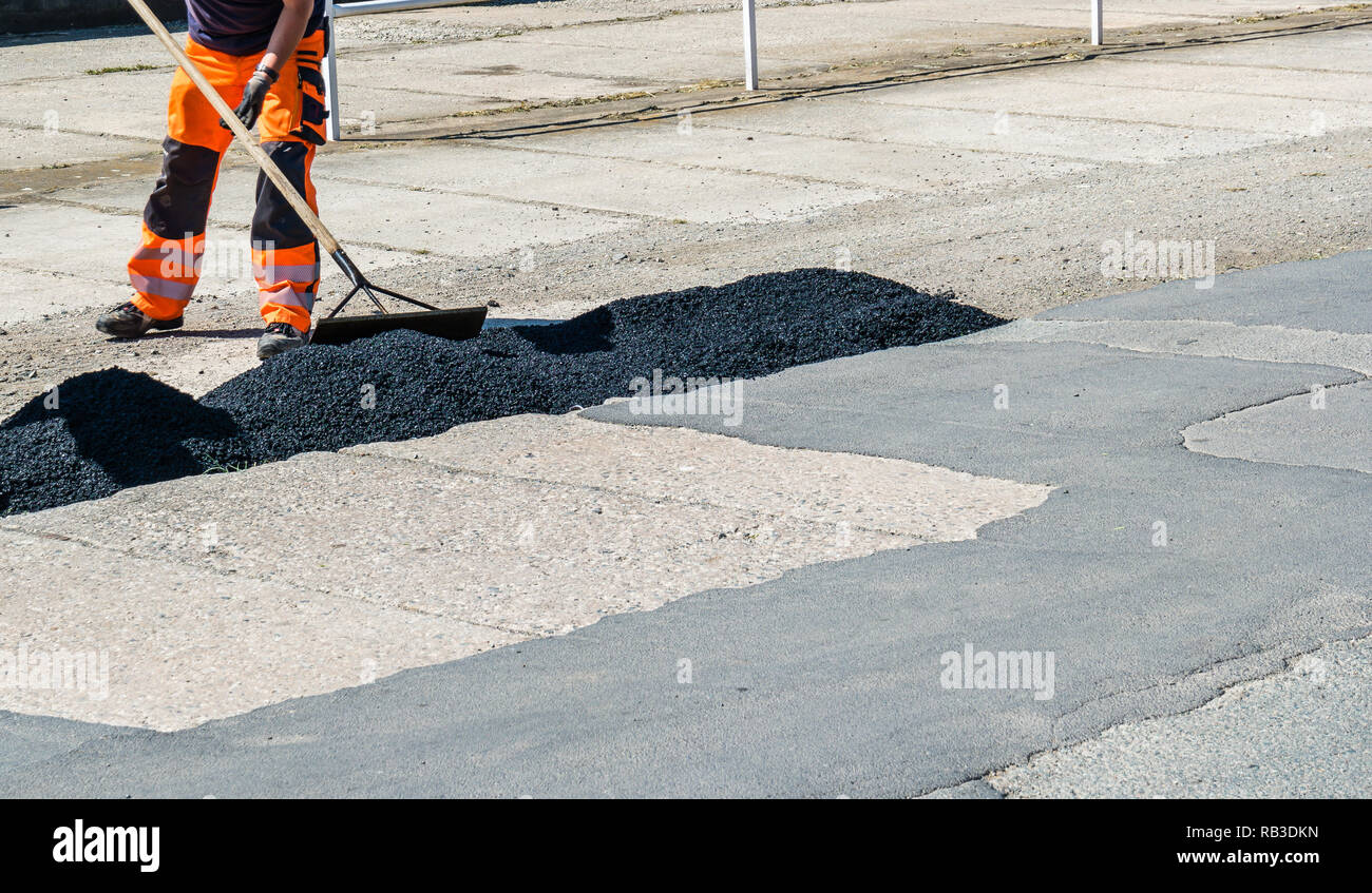 Tar road construction roadway renewal Stock Photo - Alamy