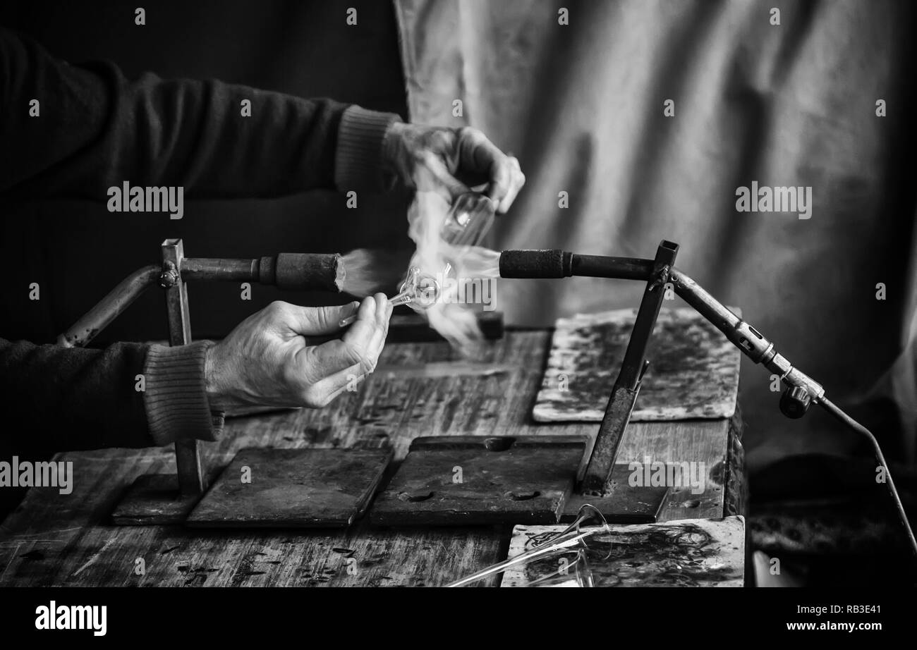 Blowing glass with fire in a traditional way Stock Photo - Alamy