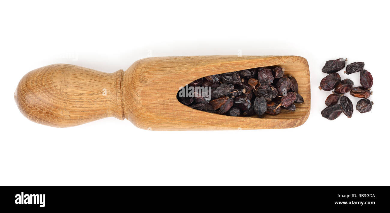 dry red barberry spices on scoop isolated on a white background. Top ...
