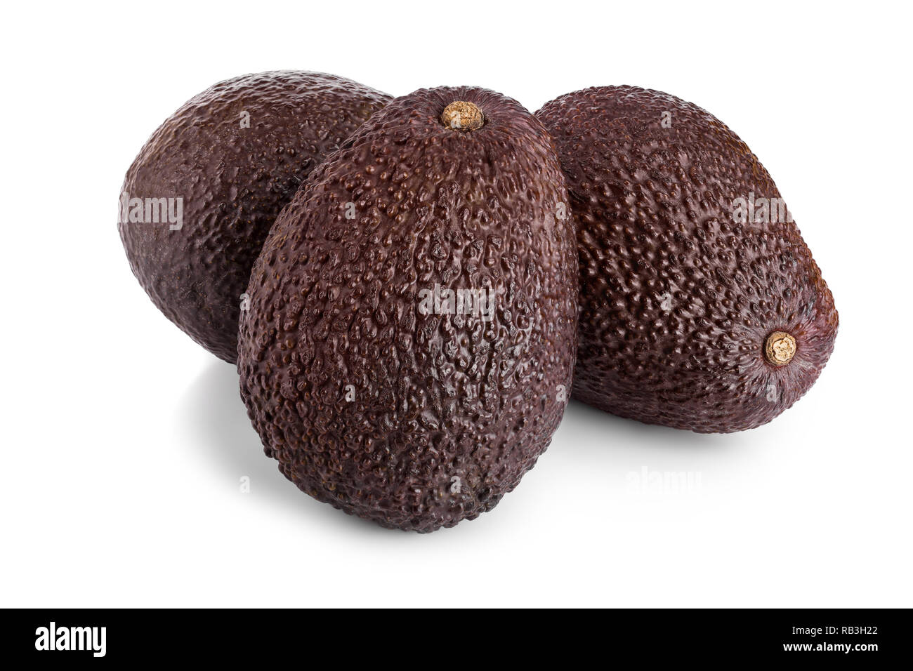 three whole avocado isolated on white background Stock Photo - Alamy