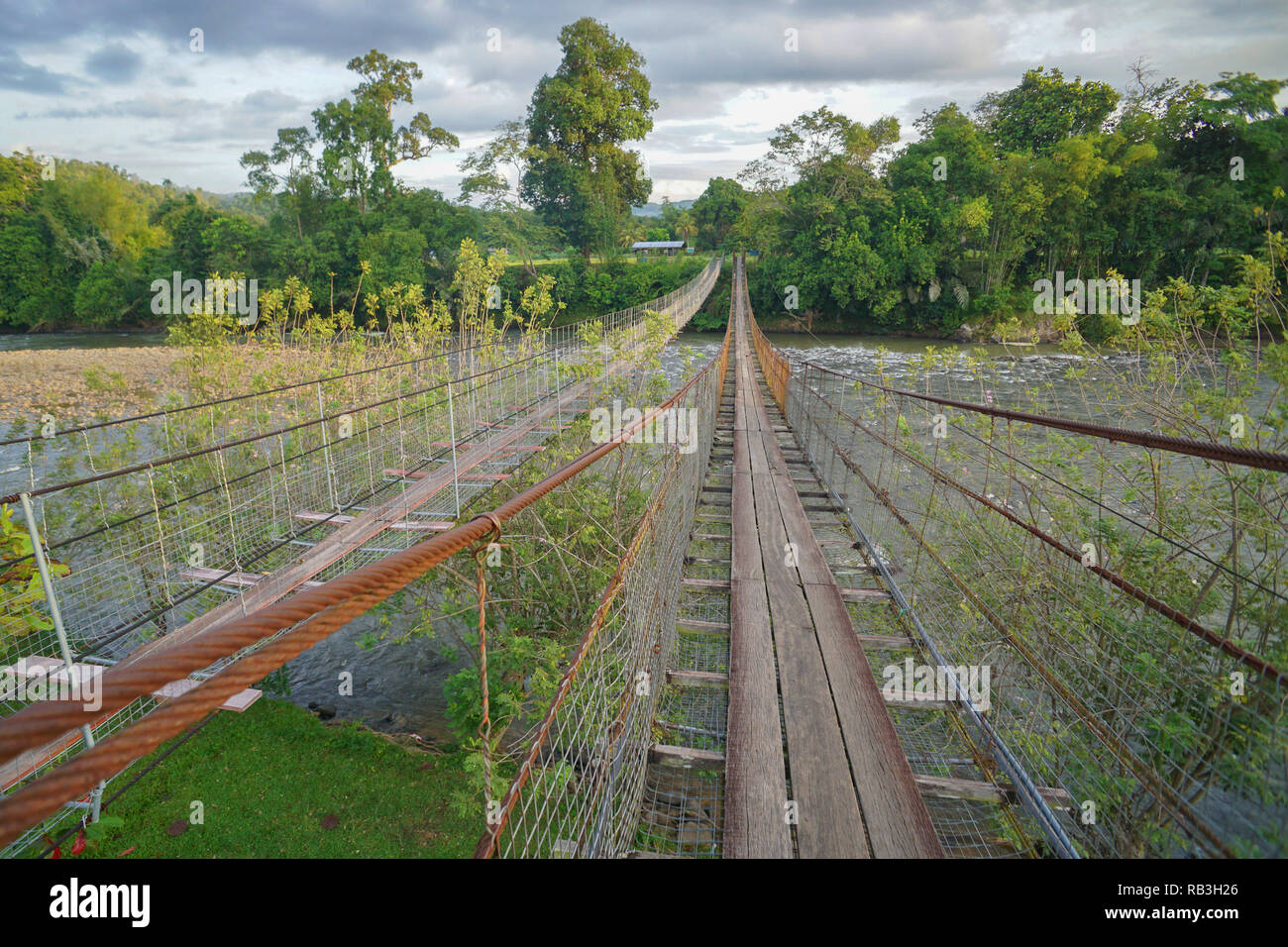 Common bridge walkway to cross river in Borneo interior Stock Photo - Alamy