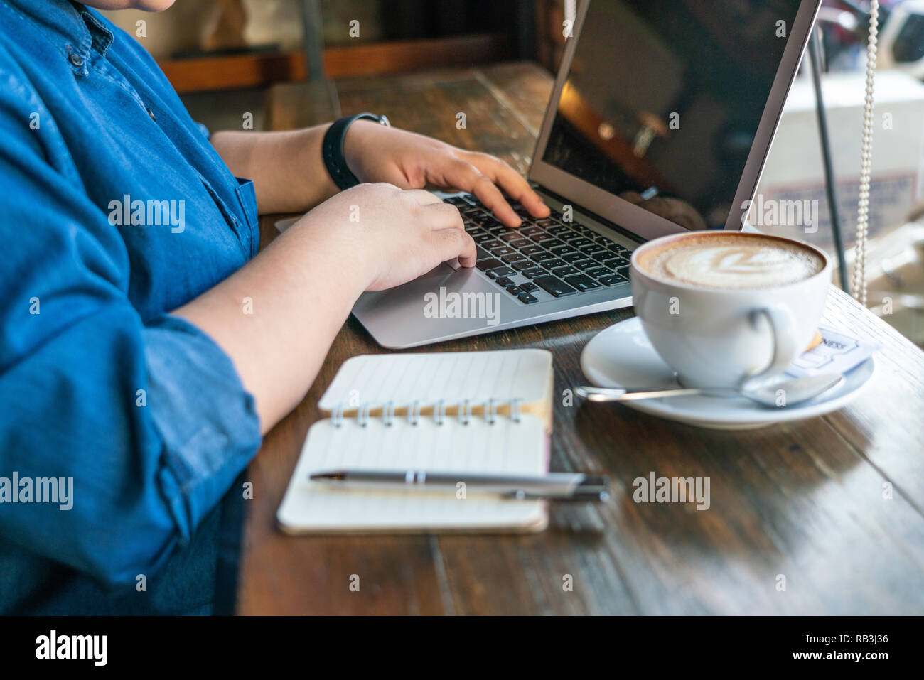 Female hand using laptop Stock Photo - Alamy