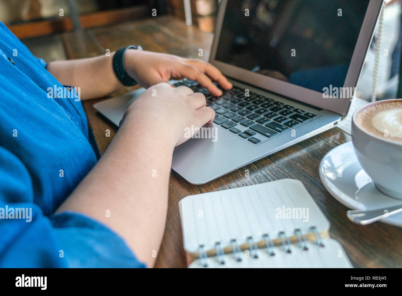 Woman hand working on laptop Stock Photo - Alamy