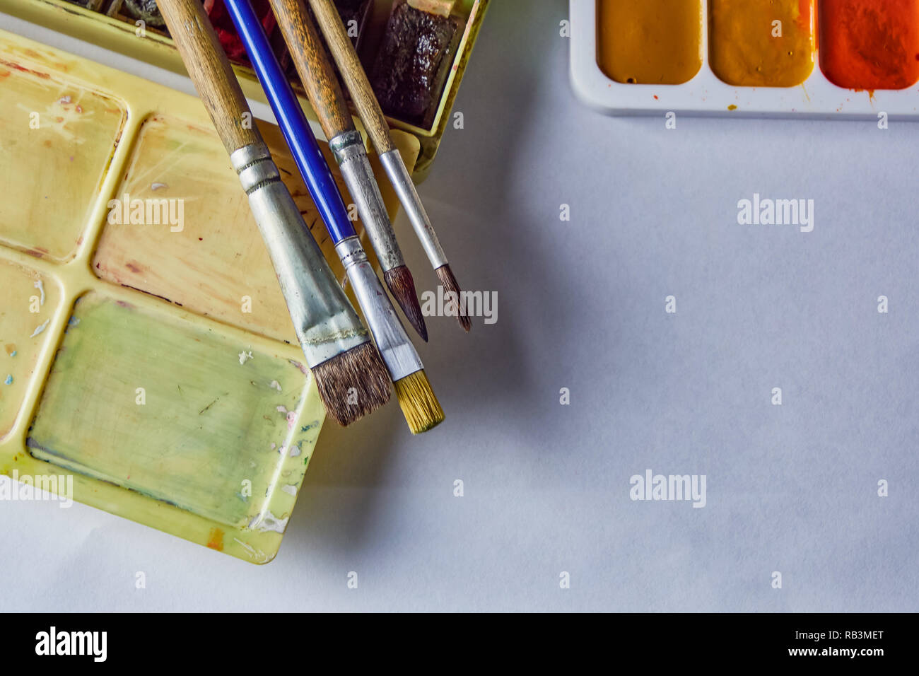 artist's tools, professional watercolor paints in a box, brushes ...