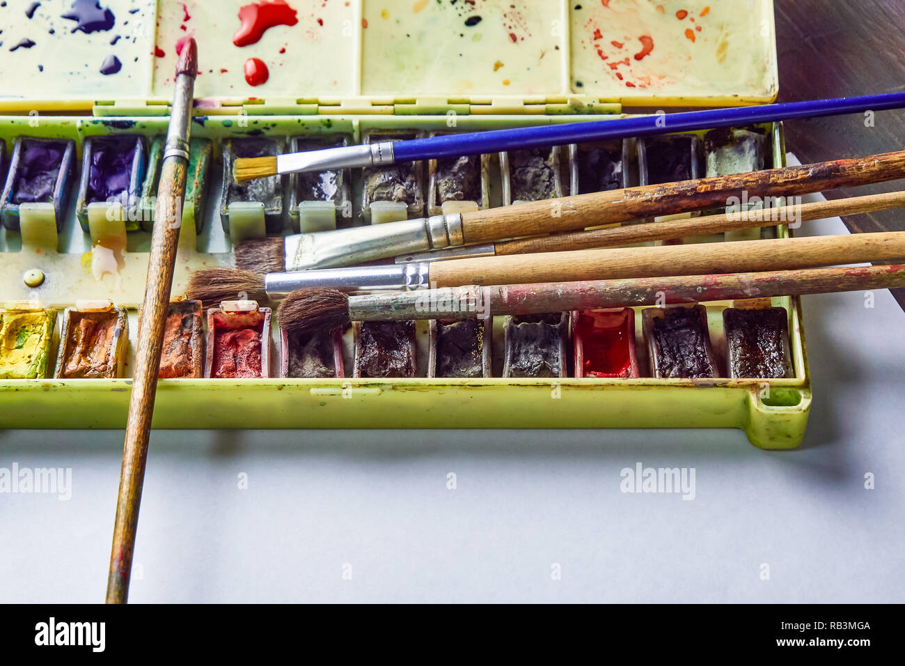 artist's tools, professional watercolor paints in a box, brushes ...