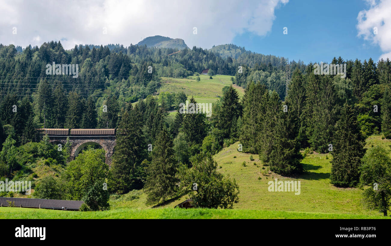 A picturesque Alpine landscape with an old railway bridge. Austria ...
