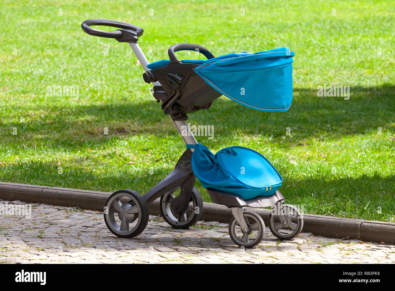 Empty baby stroller in meadow Stock Photo - Alamy