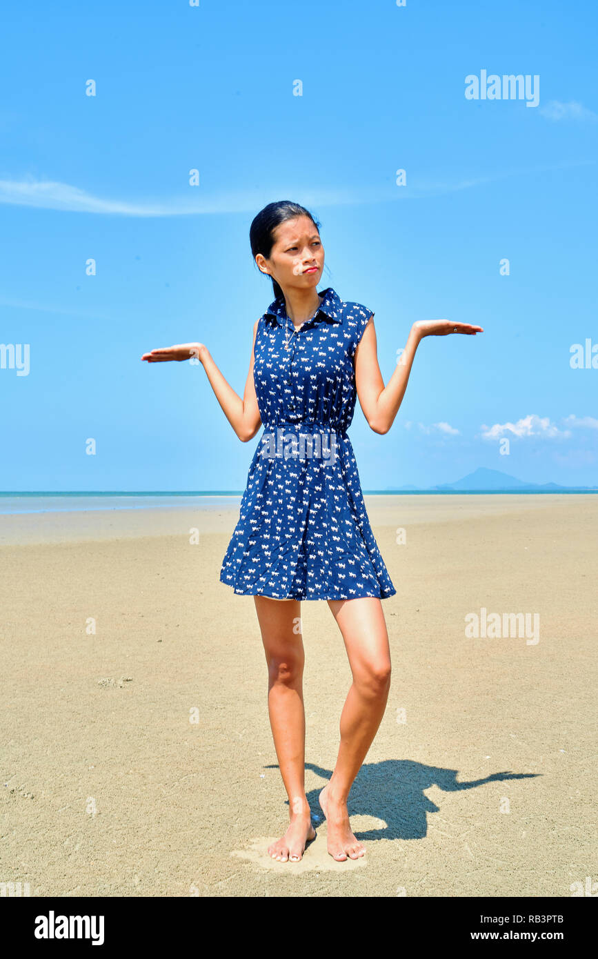 Beautiful woman posing - asking gesture Stock Photo - Alamy
