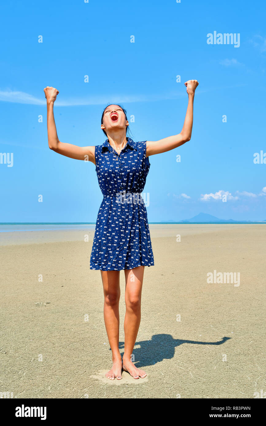 Beautiful woman posing - looking above and showing biceps Stock Photo ...