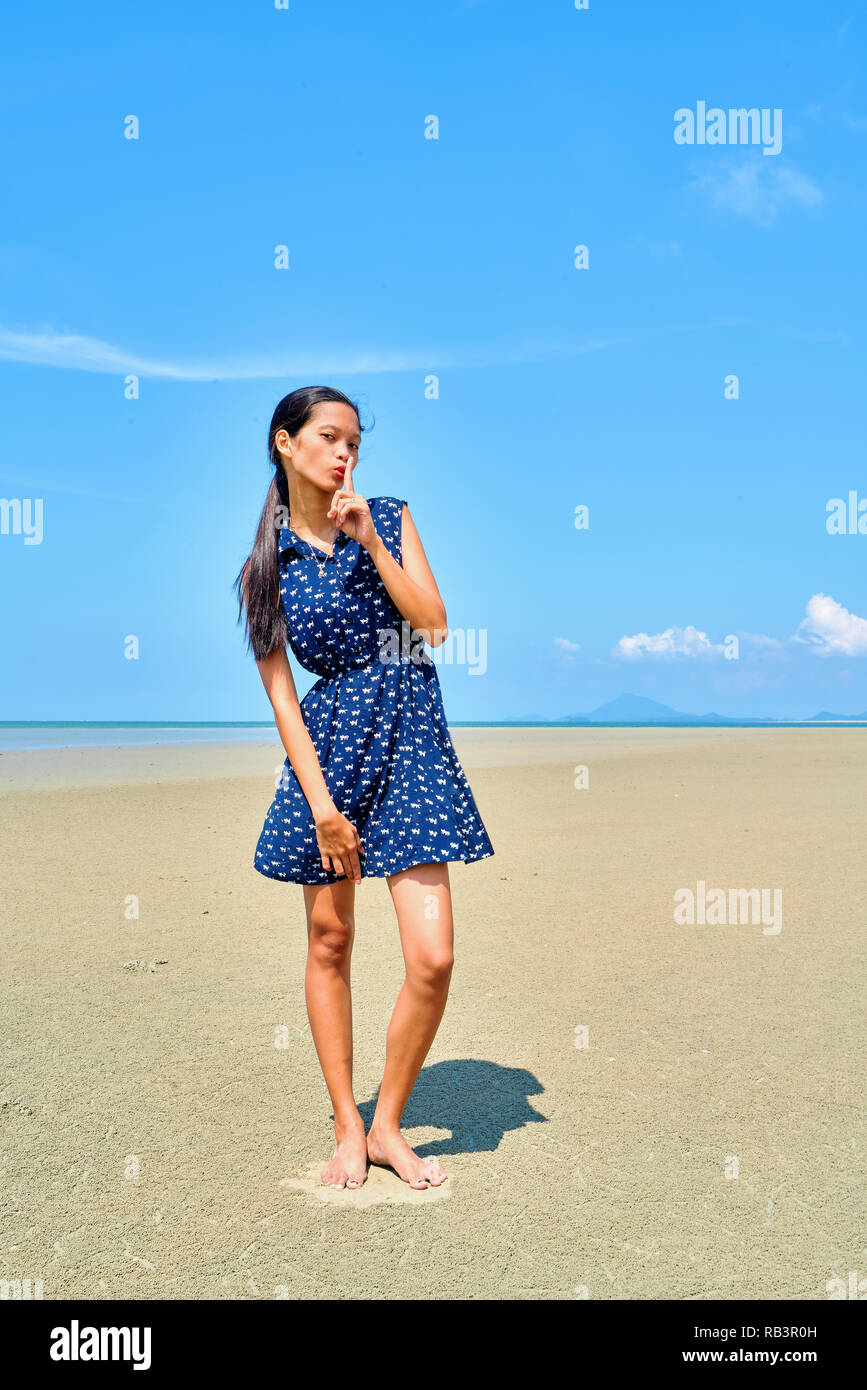 Beautiful woman posing - silent gesture Stock Photo - Alamy