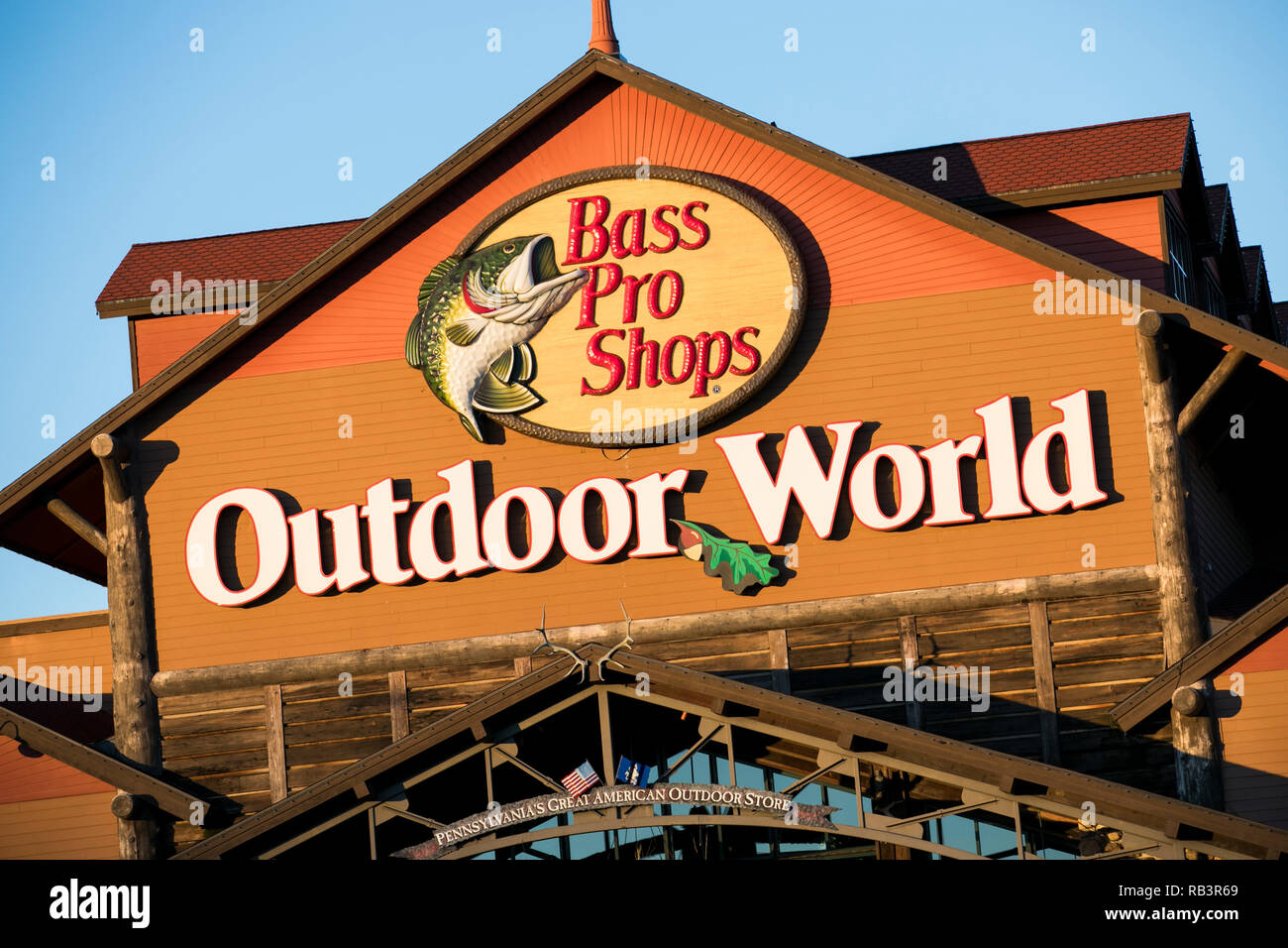 A logo sign outside of a Bass Pro Shops Outdoor World retail store in ...
