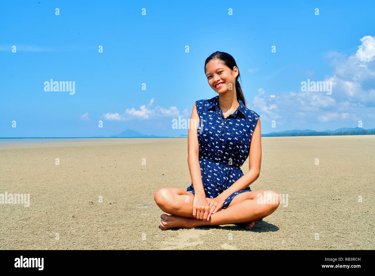 Beautiful woman posing - sitting and relaxing Stock Photo - Alamy