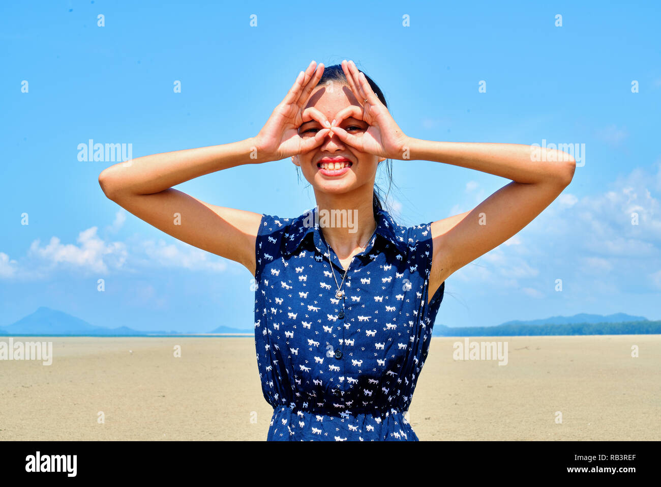 Beautiful woman posing - making a face, smiling and sign gesture Stock ...