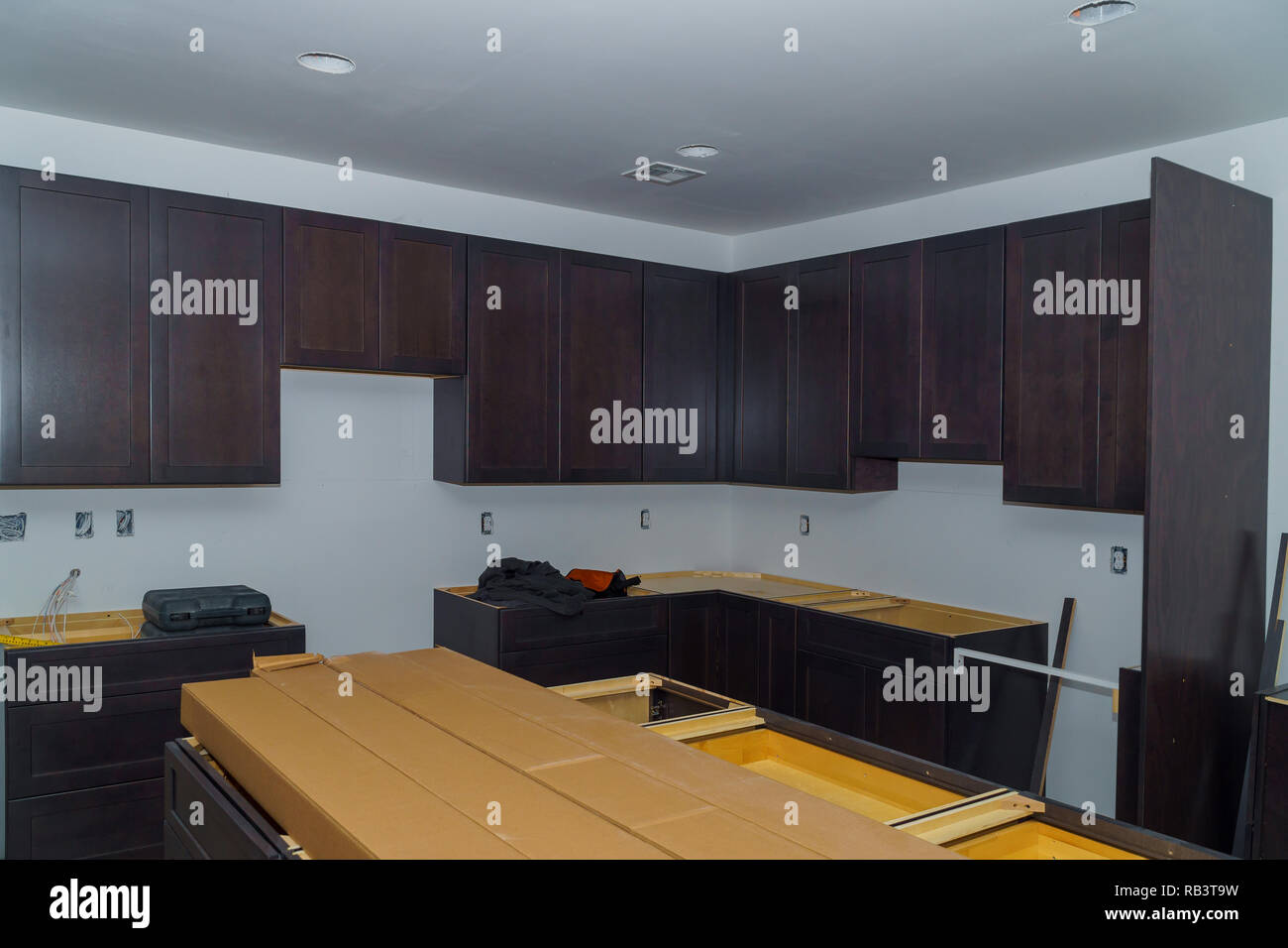 Installing new induction hob in modern kitchen kitchen Installation of ...