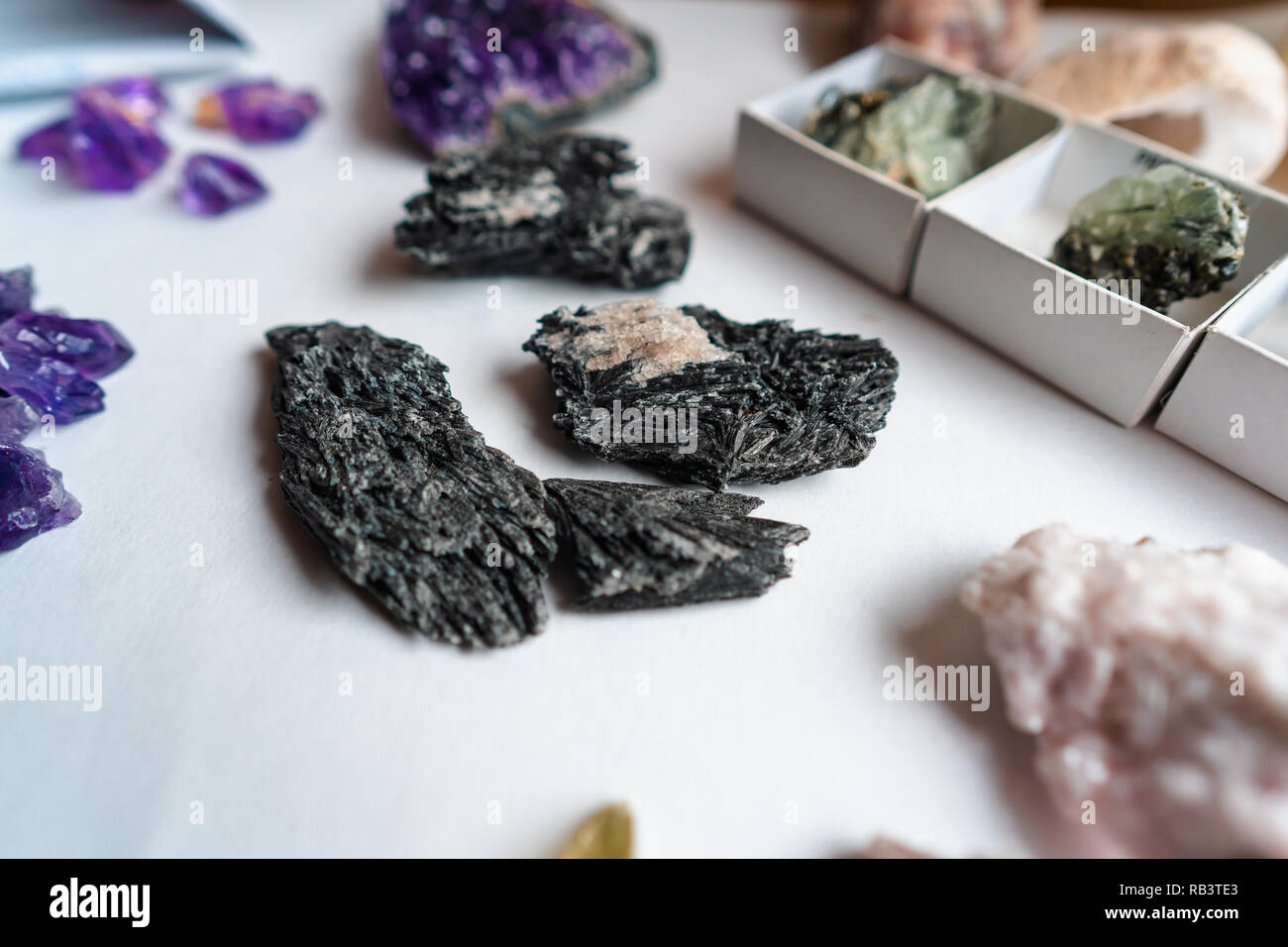 Collection of beautiful precious stones on white table Stock Photo - Alamy