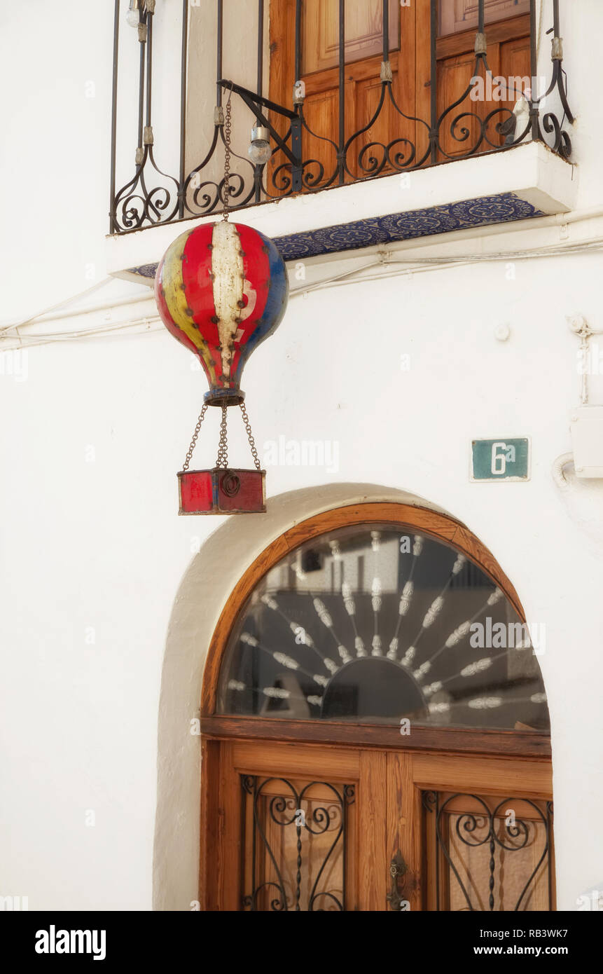 Decorative hot air balloon model hanging from a balcony in Altea ...