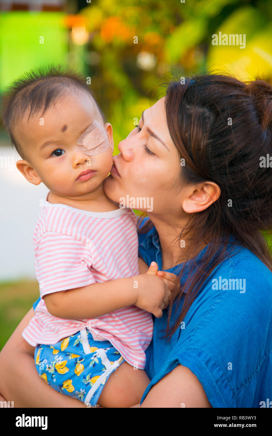 Asian female model and asian baby pose for pictures in the nature Stock ...