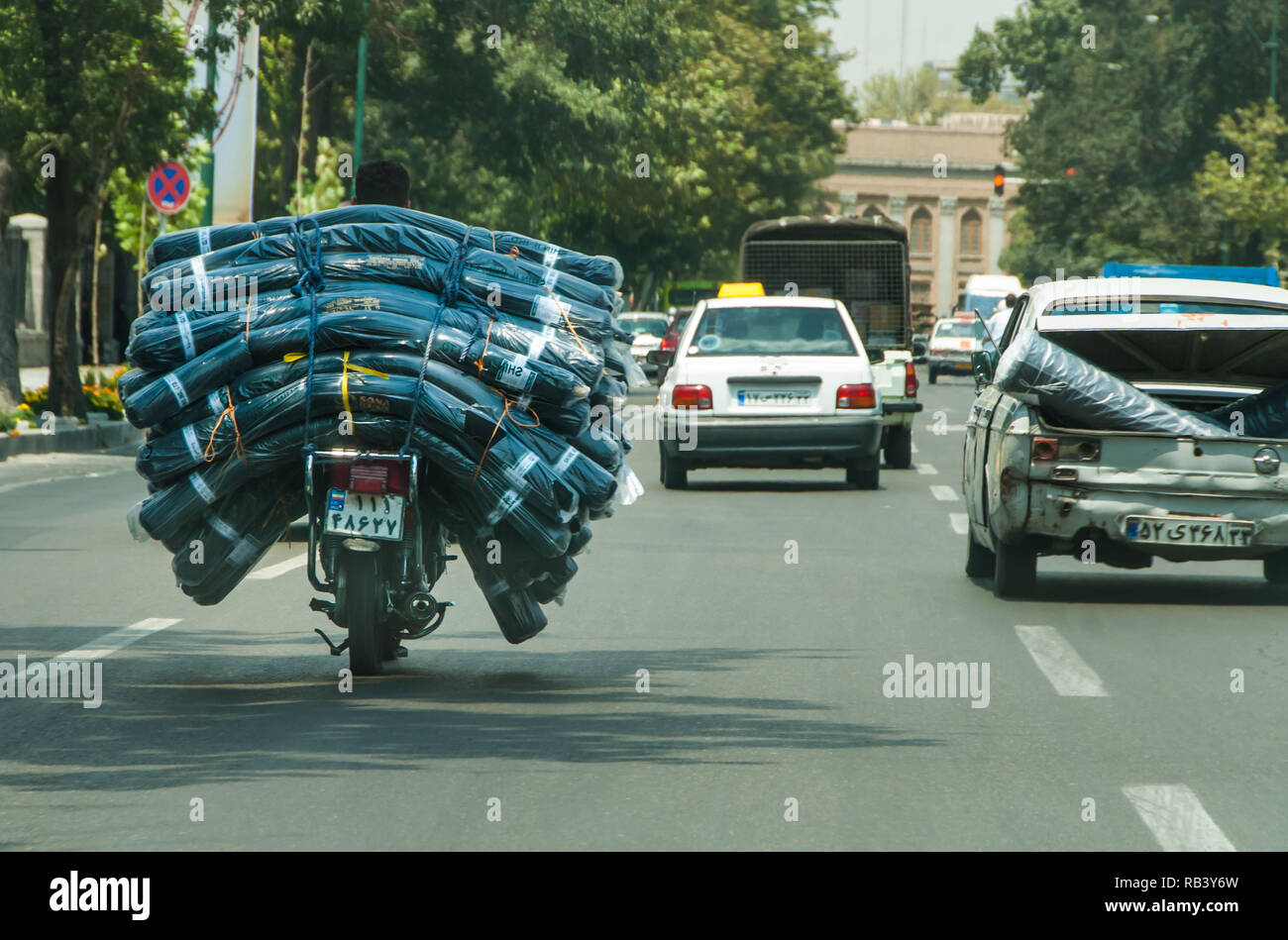Man driving overloaded motorcycle hi-res stock photography and images ...