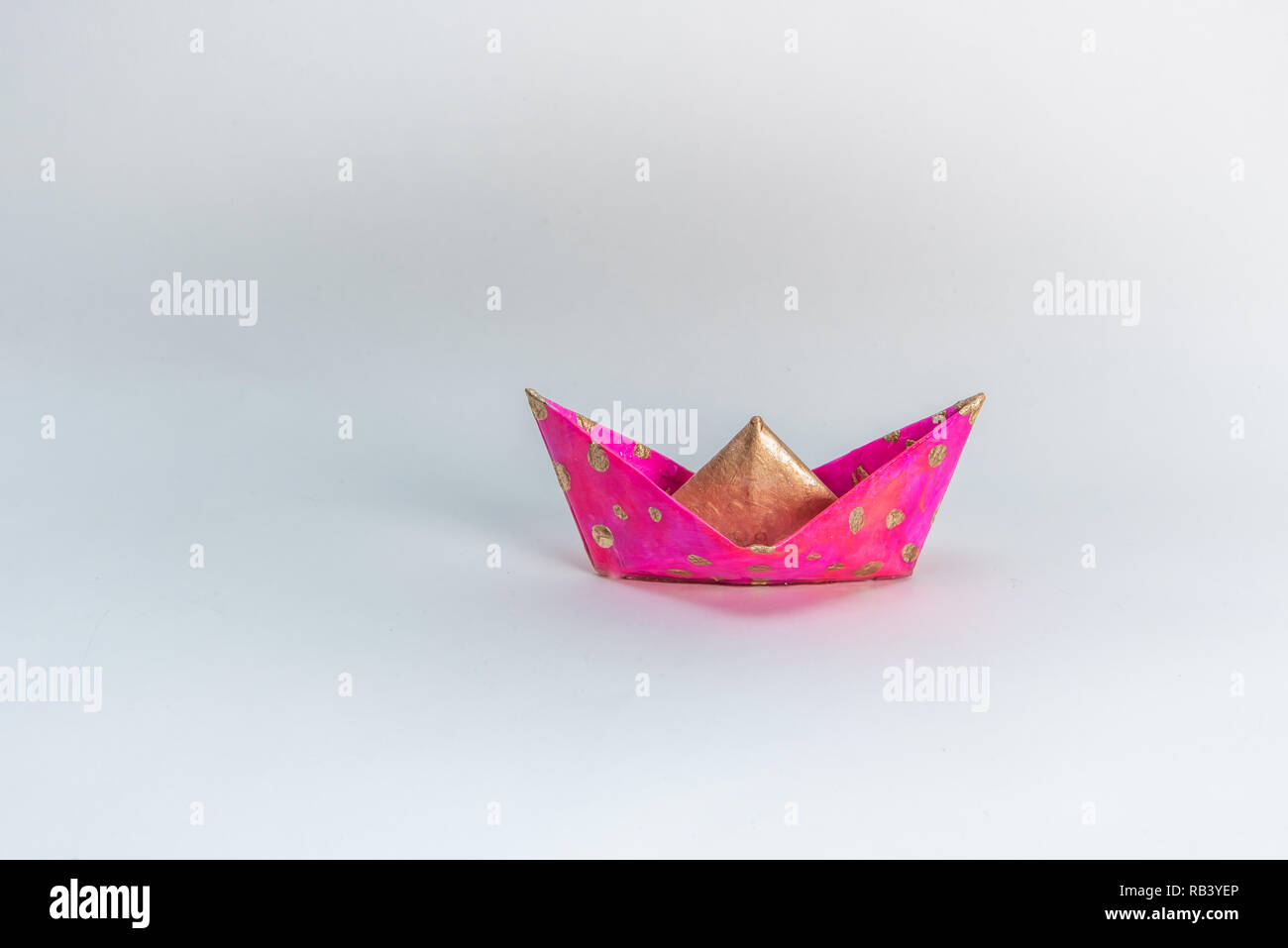 Paper boat origami folding art colored Stock Photo - Alamy
