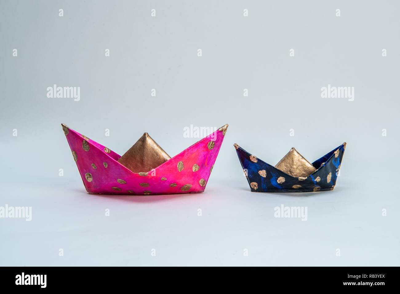 Paper boat origami folding art colored Stock Photo - Alamy