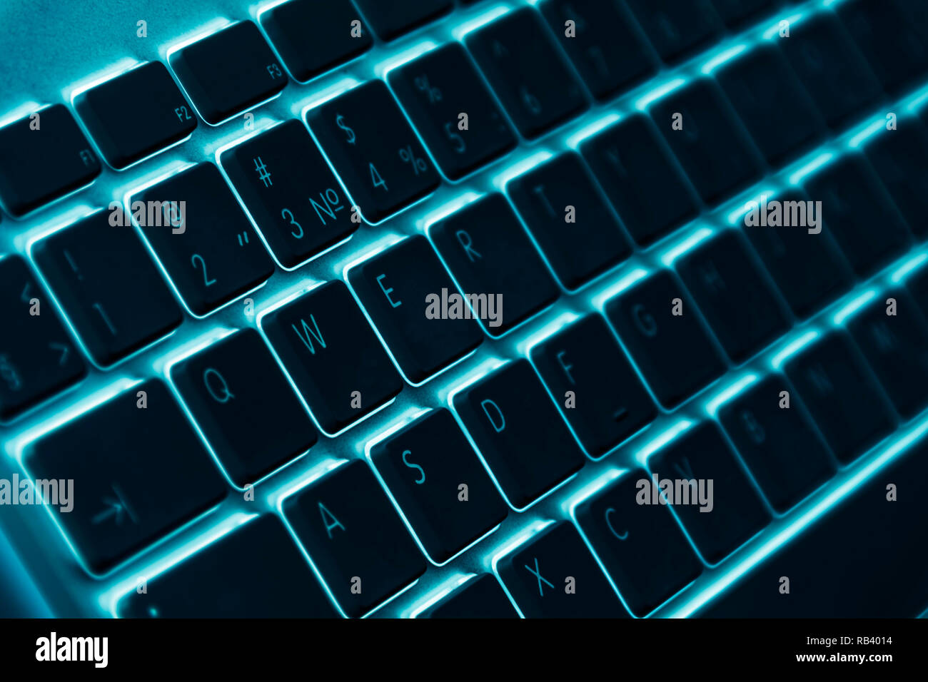 Business workplace with computer wireless keyboard on blue table ...