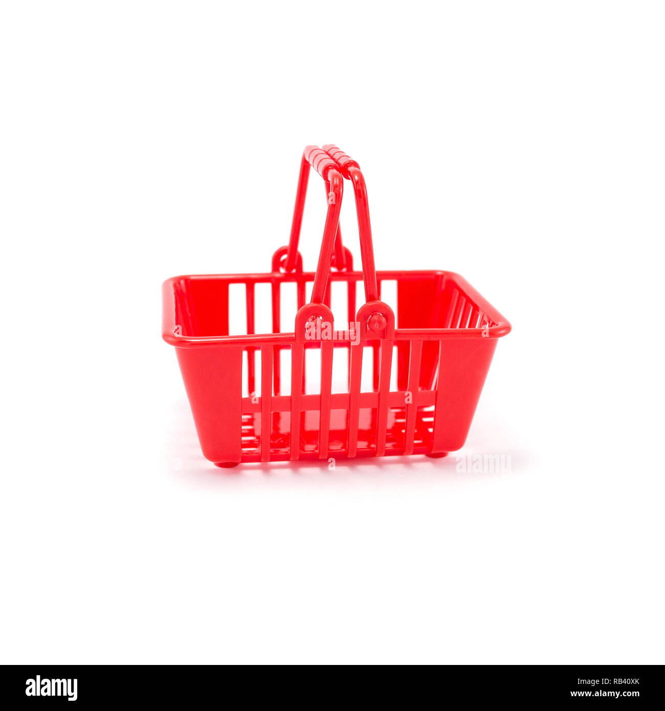 Red plastic basket isolated on a white background Stock Photo - Alamy