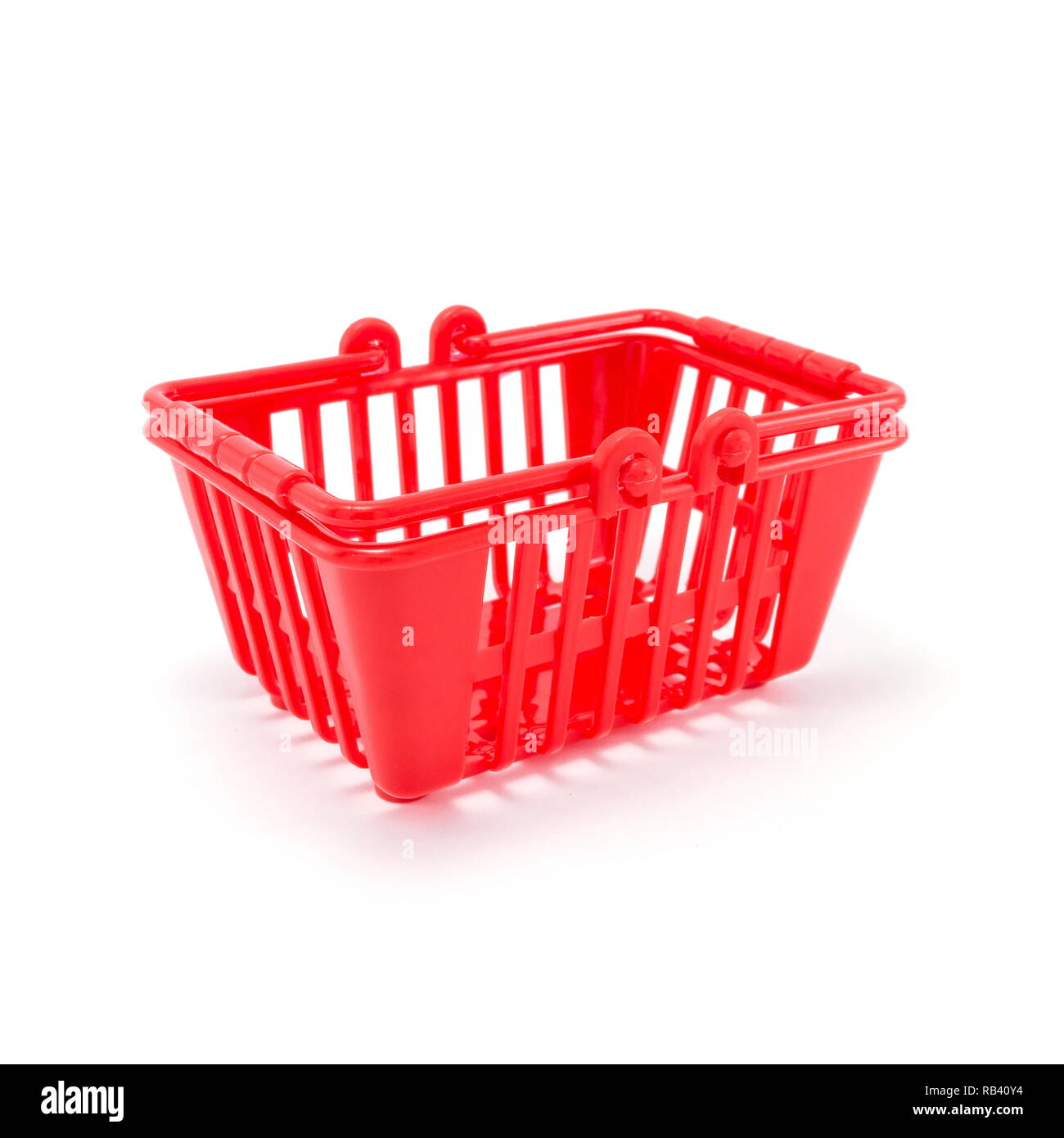 Red plastic basket isolated on a white background Stock Photo - Alamy