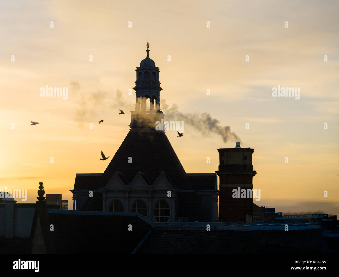 Cold tranquil sunrise in city - Edinburgh Central Library rooftop Stock ...