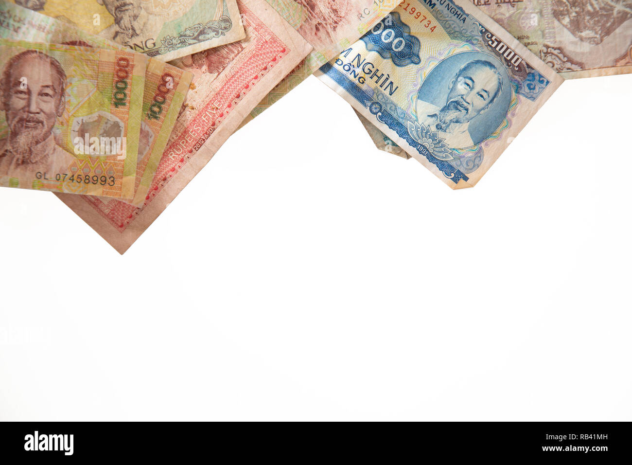 Bank notes in the currency of Vietnam, the Dong, sit on a white ...