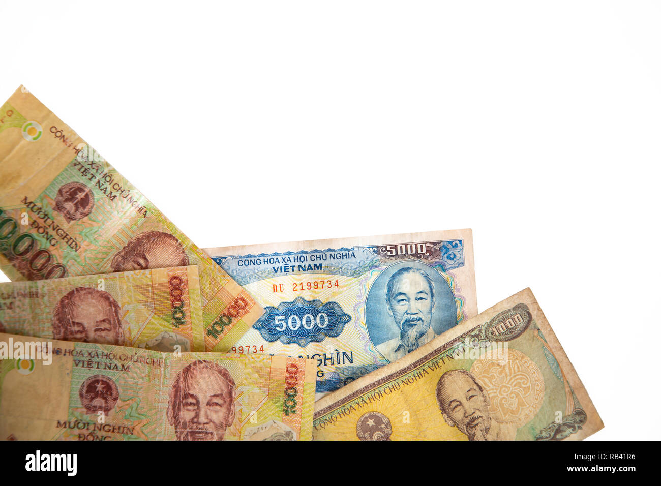 Bank notes in the currency of Vietnam, the Dong, sit on a white ...