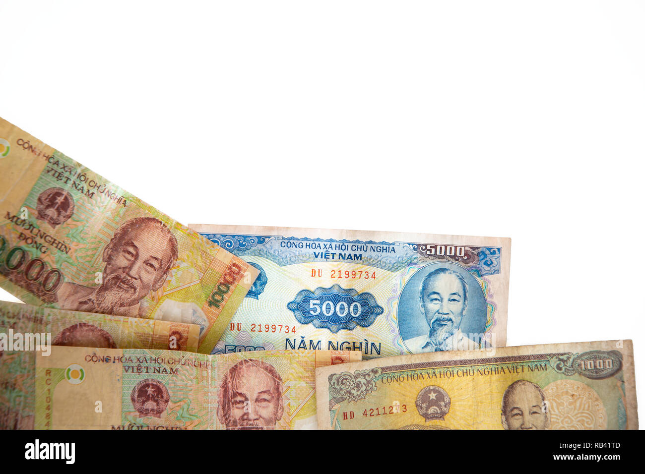 Bank notes in the currency of Vietnam, the Dong, sit on a white ...