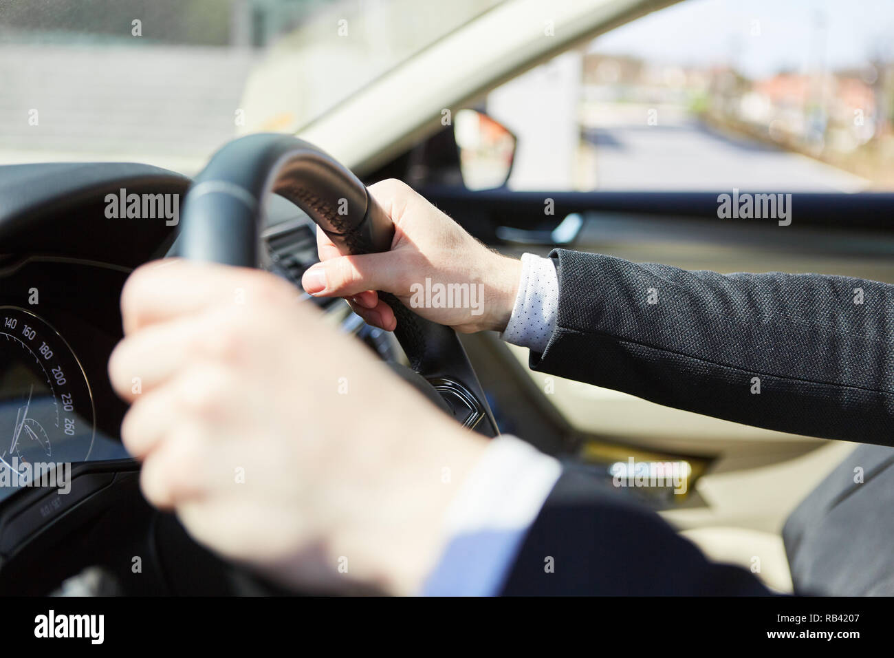 Hands of the driver on the steering wheel as a symbol of mobility Stock ...