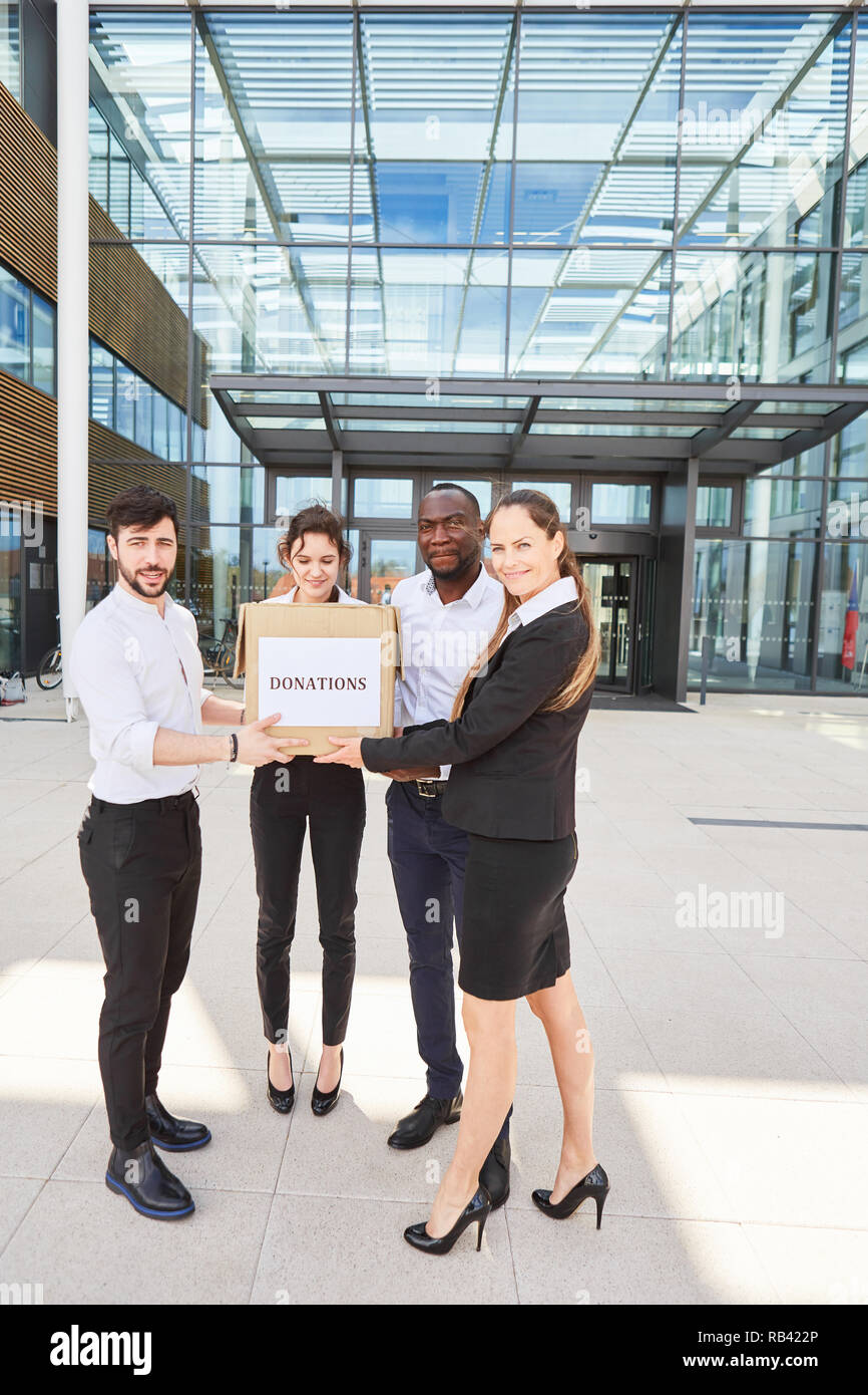 Business people consider donations box as a corporate donation and PR ...