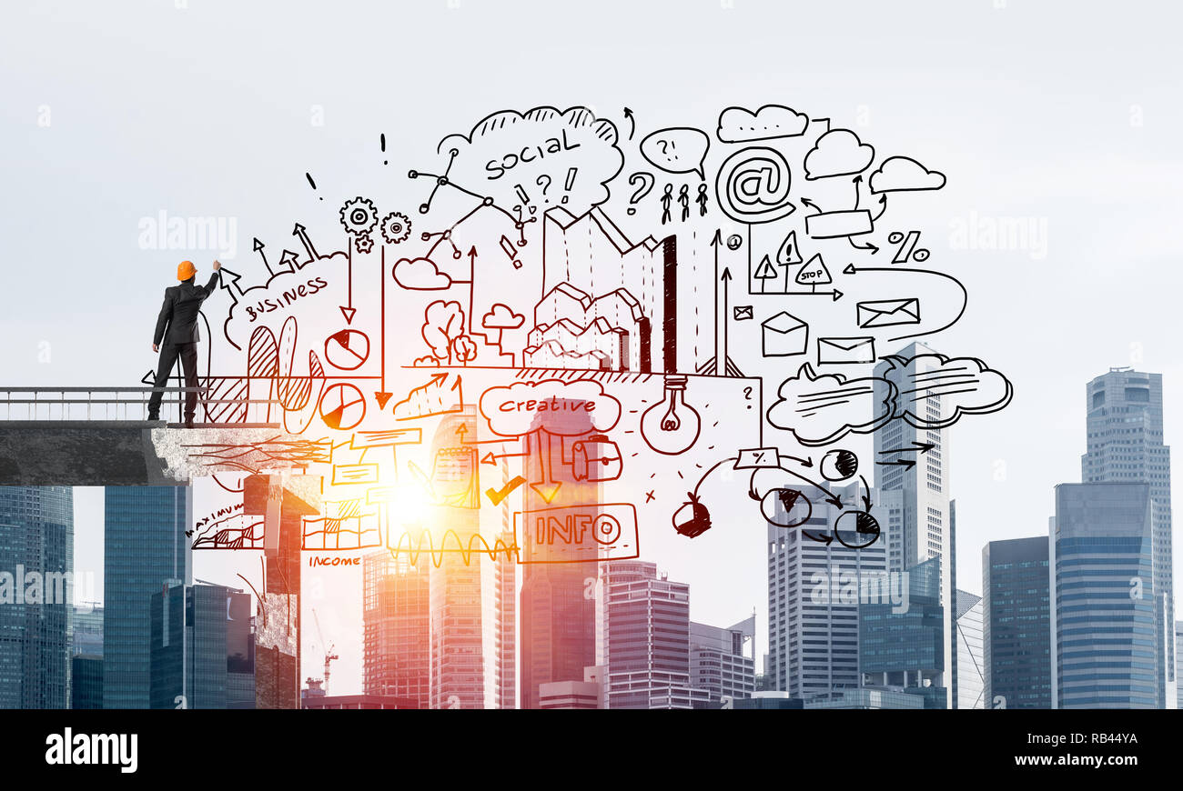 Businessman drawing business conceptual sketches Stock Photo - Alamy