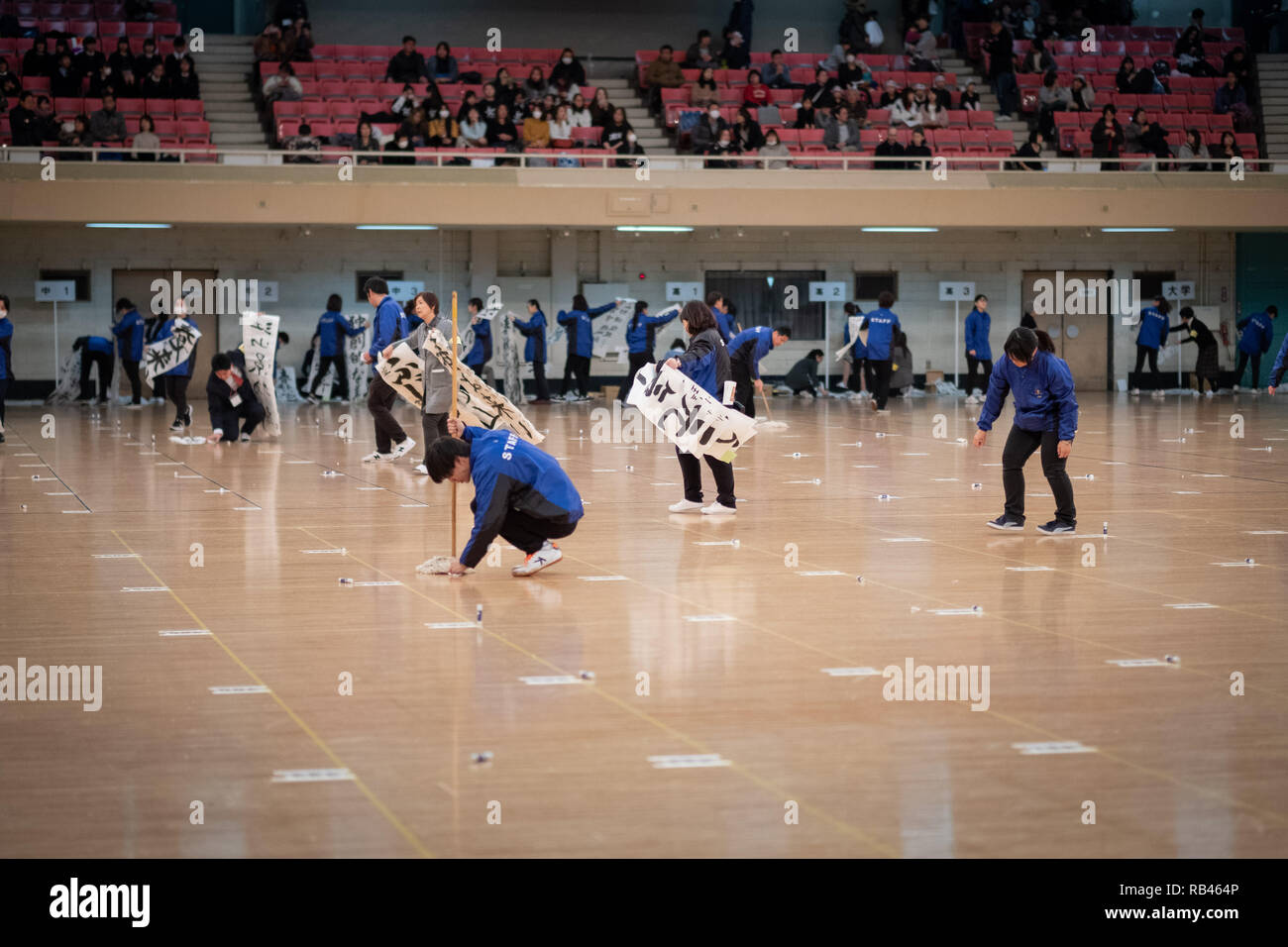 Volunteers organize calligraphies after a round at Kakizome calligraphy ...