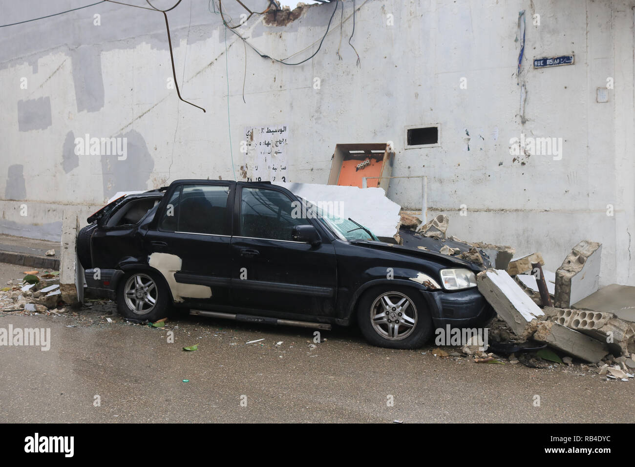 Beirut, Lebanon. 7th Jan, 2019. Masonry falls on a car causing ...