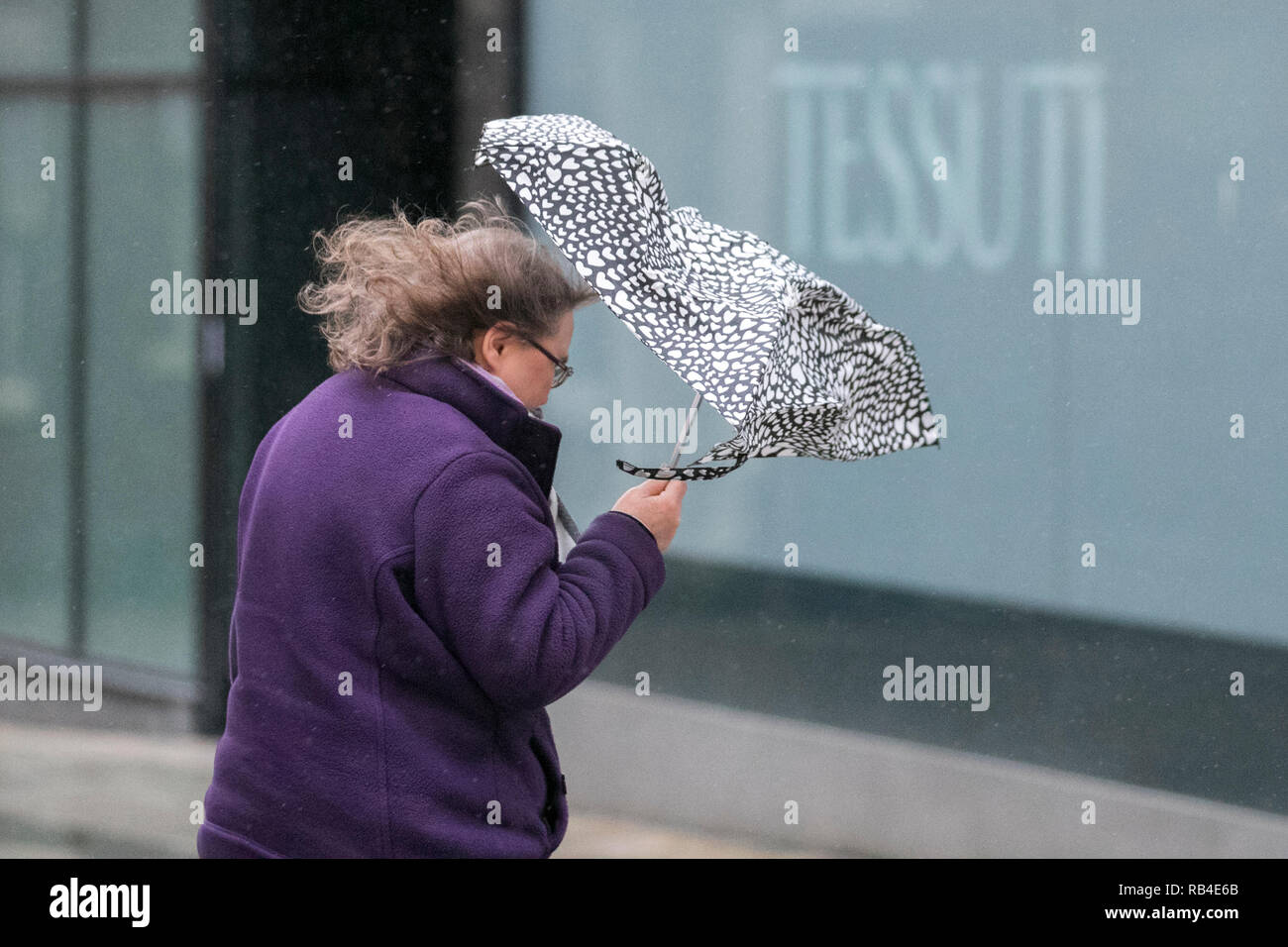 Upturned damaged umbrella hi-res stock photography and images - Alamy