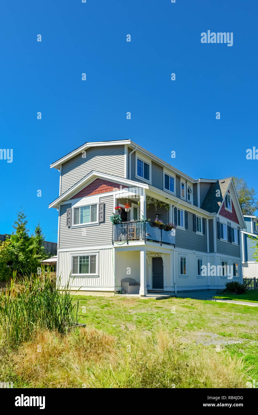 Nice residential building with decorative reeds in front on sunny day ...