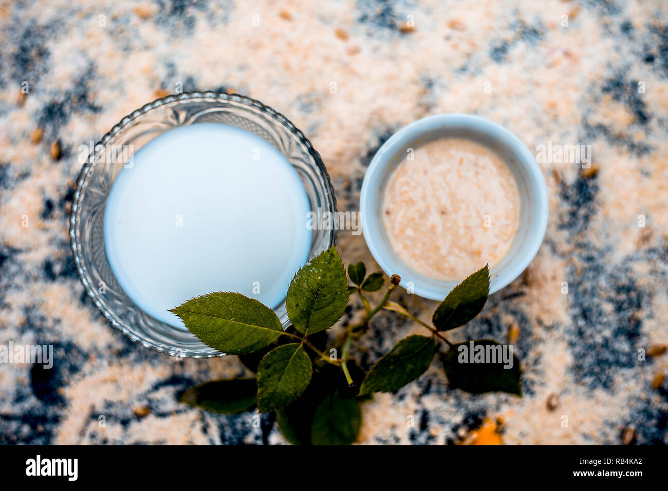 Close up of ayurvedic face pack of oats and milk only on wooden surface ...
