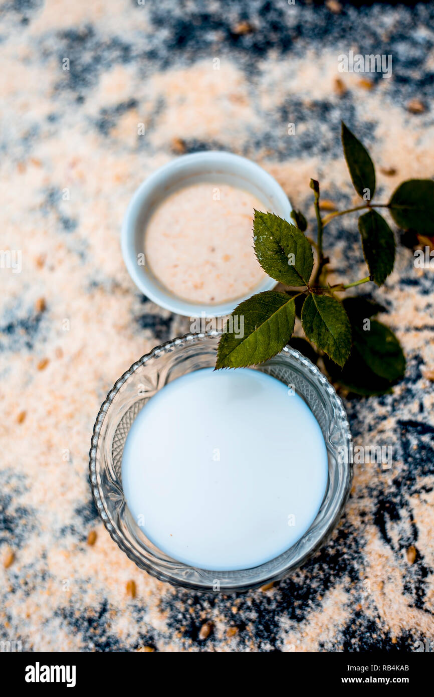 Close up of ayurvedic face pack of oats and milk only on wooden surface ...
