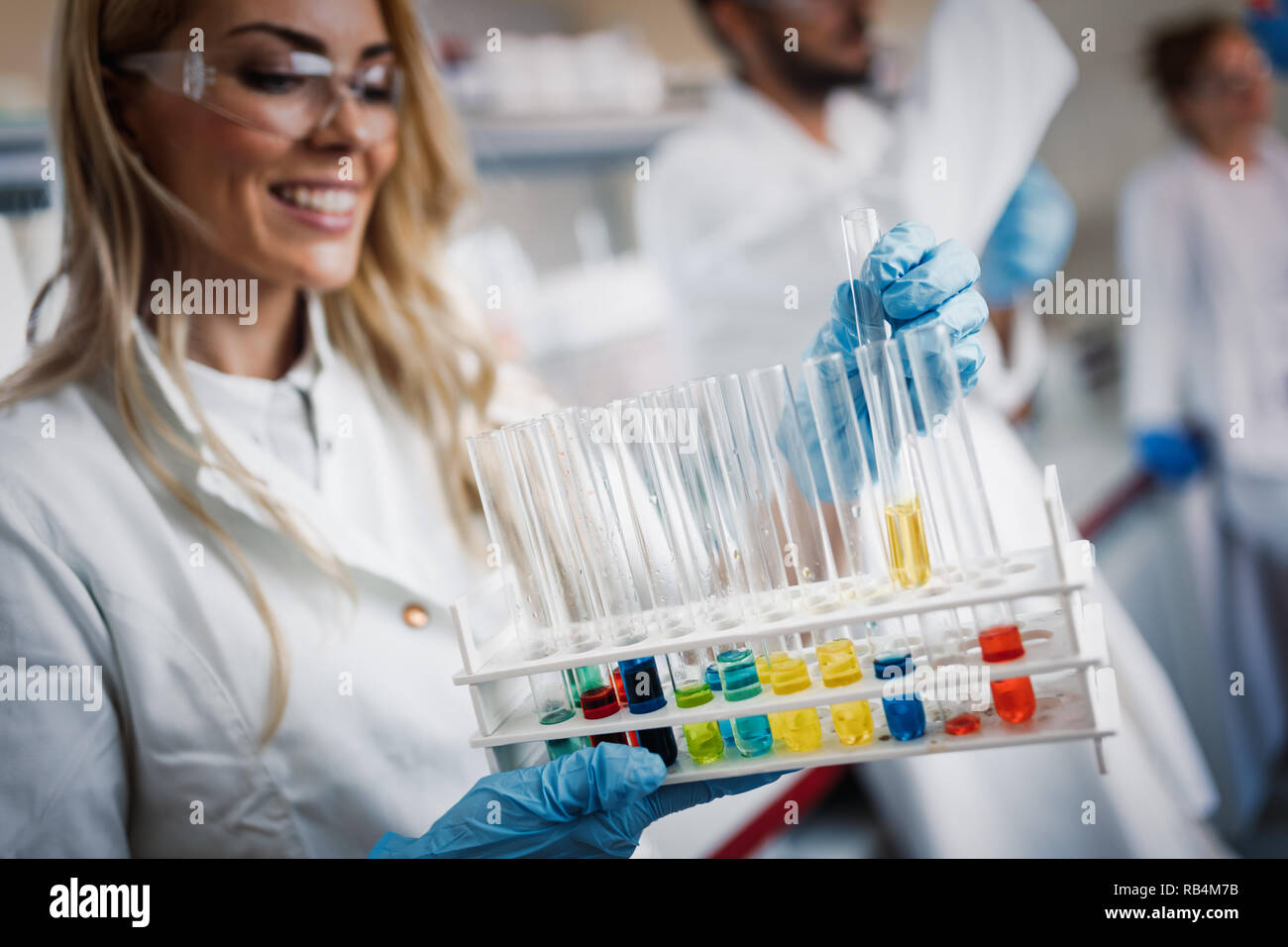 Group of students working at the laboratory Stock Photo - Alamy