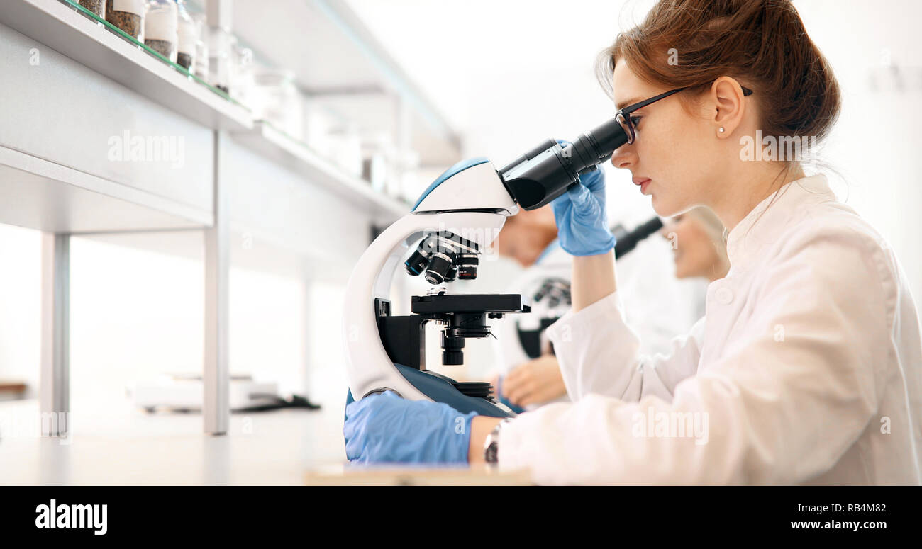 Scientist looking in microscope hi-res stock photography and images - Alamy