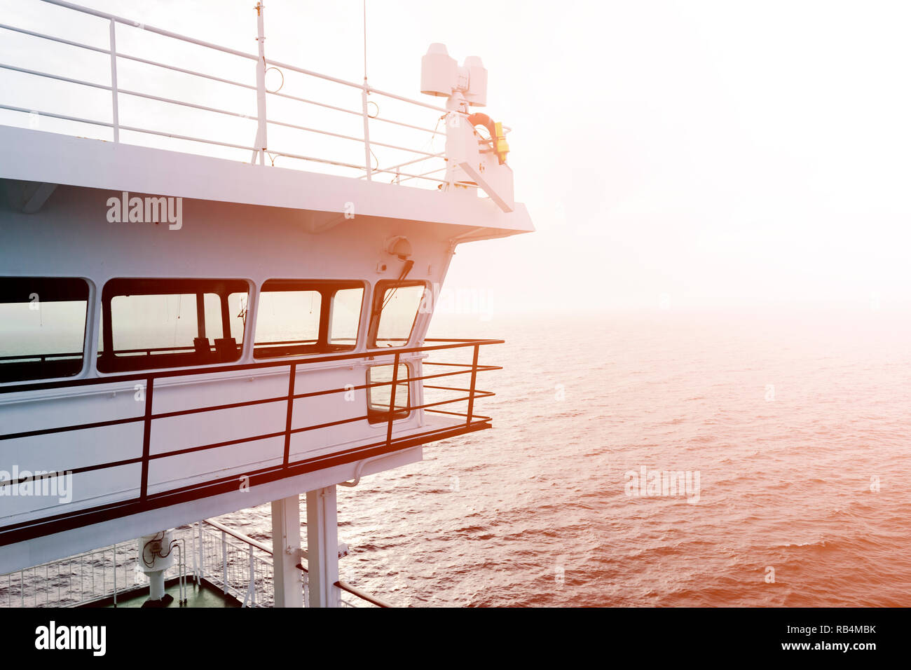 Cruise ship white cabin with big windows. Wing of running bridge of ...
