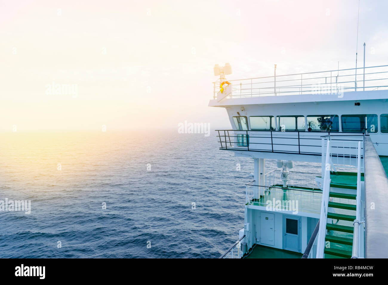 Cruise ship white cabin with big windows. Wing of running bridge of ...