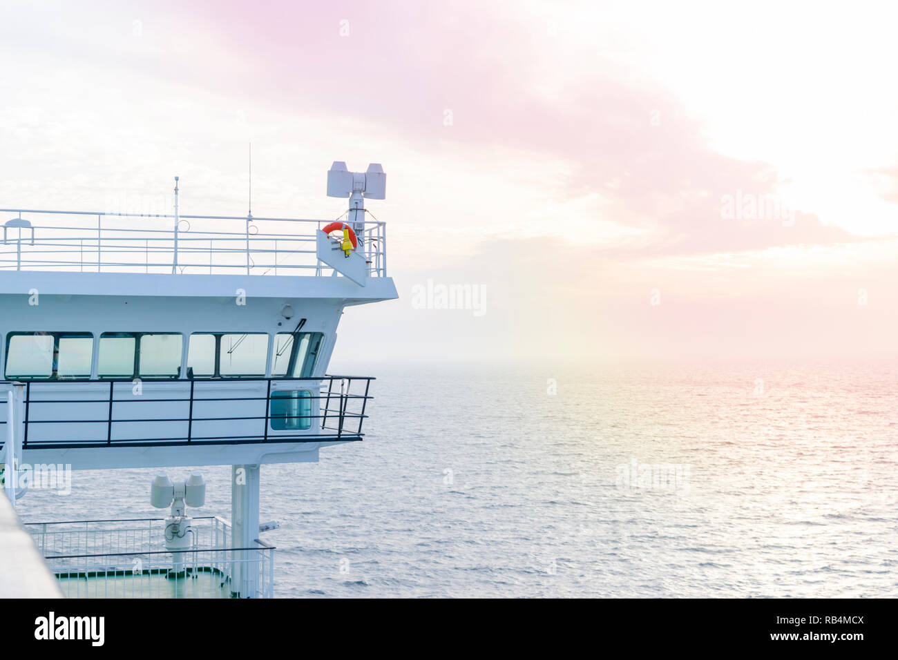 Cruise ship white cabin with big windows. Wing of running bridge of ...